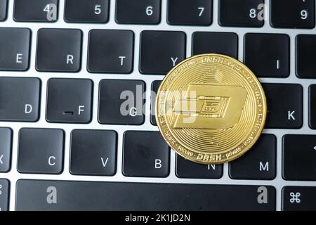 golden Cryptocurrency on keyboard laptop, Bitcoin, Dash, Zcach coins ...