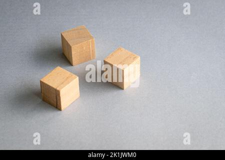 Three blank wooden cubes on top of table, top view. Free text and copy ...