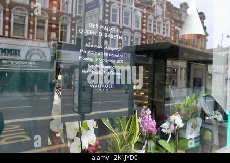 waitrose shop window displays and closed signs in muswell hill on 19th ...