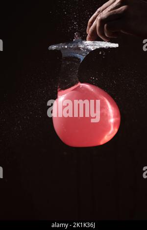 balloon filled with water exploding Stock Photo - Alamy