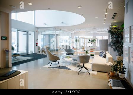 Seating in the foyer of modern office. Modern minimalist desk or ...