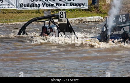 swamp buggies, racing, mostly submerged in water, contest, motion ...