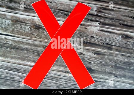 A pair of car phosphorescent reflective stickers isolated on wooden ...