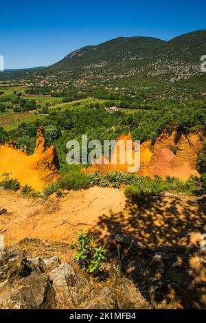 View of Rustrel Village and Bay from the Colourful Ochres of the ...