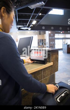 Airport check in weighing scale showing 23 kg kilograms / scales ...