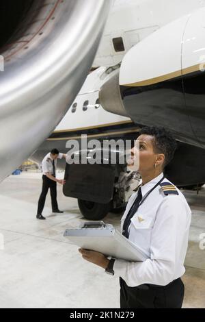 Pilot perform a preflight check on a cessna skyhawk inside the cockpit ...