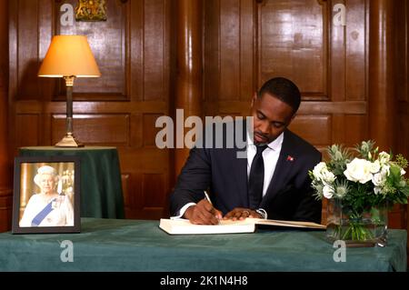 Premier of Bermuda, Edward David Burt, signs a book of condolence at ...