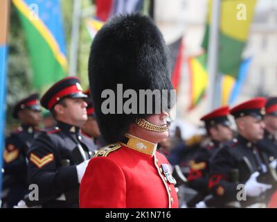 A soldier wearing a bearskin on The Mall at the state funeral of Queen ...