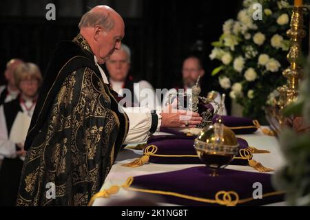 The Dean of Windsor, The Rt Revd David Conner, places the Imperial ...