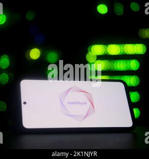 AI logo stable diffusion on the phone screen on the background of the server room. Smartphone ...