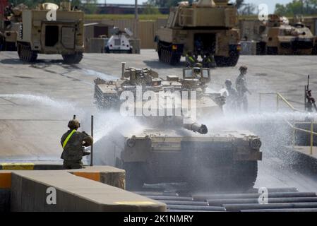 Soldiers wash an M1 Abrams tank at Fort Riley, Kansas’ Installation ...
