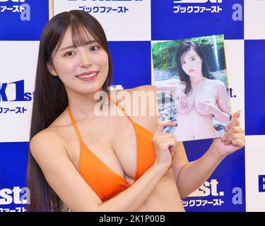 Japanese pin-up model Hana Takeuchi poses for photographers during launch event for her first ...