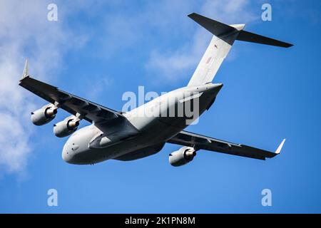 A closeup of Royal Airforce RAF Boeing against a blue sky background ...