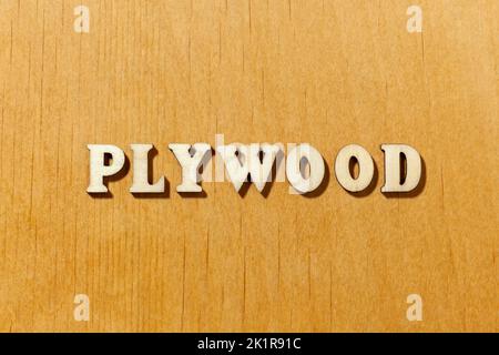 Word 'Veneer' by wooden letters close up Stock Photo - Alamy