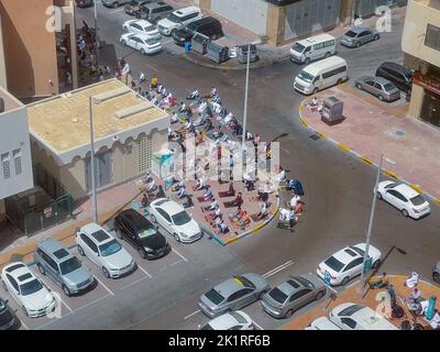 Aerial high shot of muslims praying outside a mosque due to it being ...