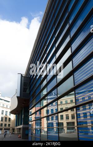 Exchange Crescent buildings reflected in modern glass building ...