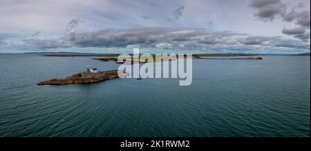 Aerial view of the historic Fenit Lighthouse on Little Samphire Island ...