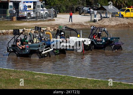 swamp buggies starting race, water splashing, vehicle sport, fast ...