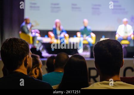 Audience against stage with speakers Stock Photo - Alamy