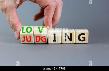 Loving or judging symbol. Concept words Loving or Judging on wooden ...