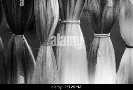 Colored synthetic hair. Strands of colorful artificial hair to attach ...