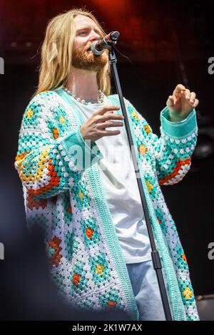 A vertical shot of the singer Sam Ryder during his performance at ...