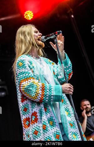 A vertical shot of the singer Sam Ryder during his performance at ...