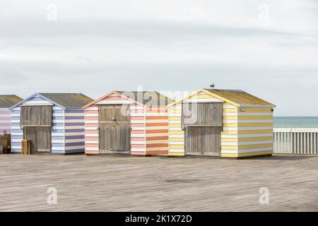 colourfull pier huts on hastings pier, copy space Stock Photo - Alamy