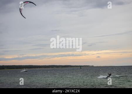 A kiteboarder enjoying a windy new England day off the coast of Marthas ...