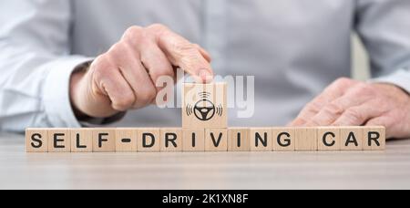 Wooden blocks with symbol of self-driving car concept Stock Photo - Alamy