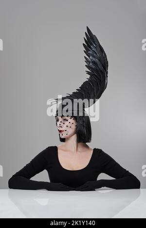 Let your creativity take flight. a young woman in a wing-shaped ...