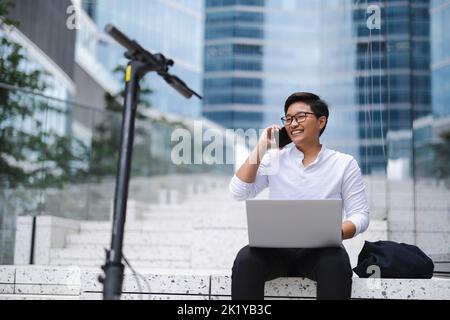 Handsome student working on laptop in bar Stock Photo - Alamy