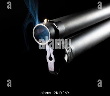 Smoking gun - smoke coming out of barrel of gun after bullet has been ...