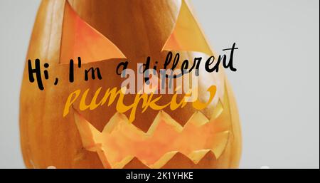 Image of halloween text over carved pumpkin bucket with sweets on grey ...