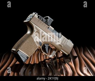 Semi automatic handgun with black and wavy copper background Stock ...