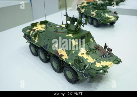 Mini models of Ukrainian armoured personnel carriers placed on counter ...