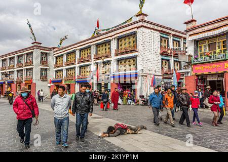 Tibetan buddhist pilgrims undertake the Kora clockwise circumambulation ...