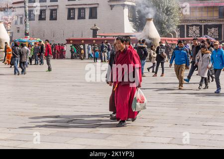 Tibetan buddhist pilgrims undertake the Kora clockwise circumambulation ...