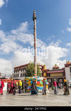Tibetan buddhist pilgrims undertake the Kora clockwise circumambulation ...