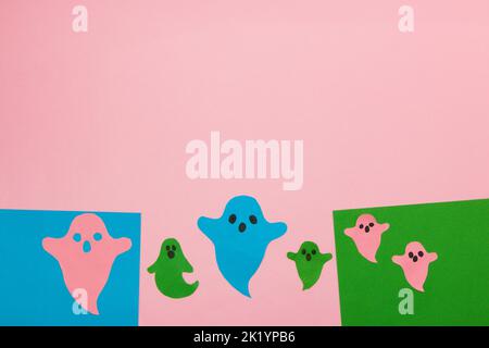 colorful ghosts at the bottom of pink background on pink feathers ...