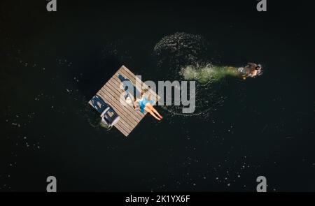 Swimming trunks floating on water surface Stock Photo - Alamy