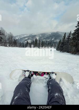 snowboarder at the hill enjoying mountains landscape point of view ...