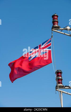 The Red Ensign or ' Red Duster ' flag hoisted on the mast of a sailing ...