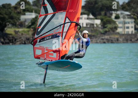A woman competes in a national windsurfing hydrofoil race at the ...
