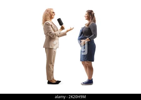 Female reporter interviewing a pregnant woman and camera man recoridng isolated on white ...