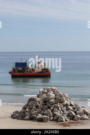 Offloaded armour rocks for breakwater construction Coverack Bay with ...