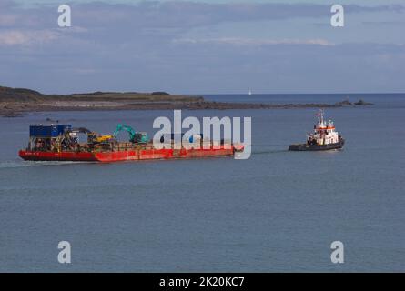 Transport barge after offloading armour rocks for breakwater ...