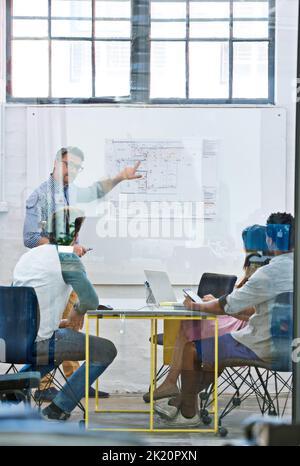 Architectural Discussion. Professionals explaining design concepts with ...