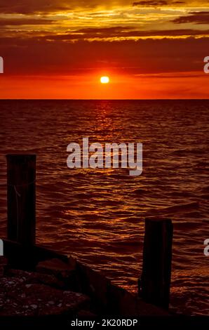 The sun sets at Cedar Point Fishing Pier, January 3, 2025, in Coden ...