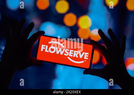In this photo illustration, the Flowserve Corporation logo seen ...